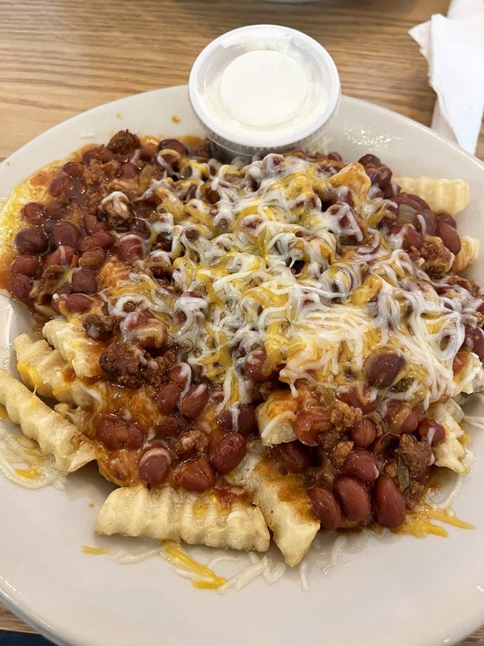 Chili cheese fries that laugh in the face of diet culture – a glorious mess that requires both a fork and absolutely zero regrets.