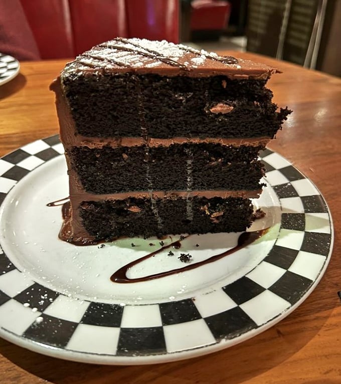This chocolate cake isn't just dessert, it's three stories of cocoa architecture that deserves its own zip code.
