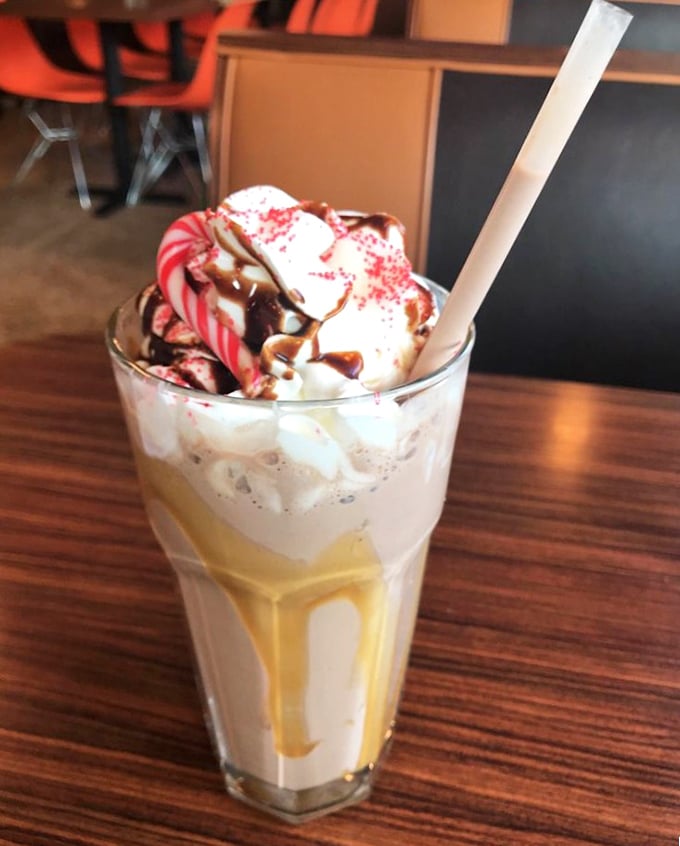 This isn't just a milkshake – it's a dessert skyscraper with whipped cream penthouses and candy condominiums.