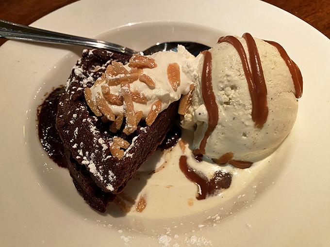 Chocolate decadence that makes diets disappear faster than magicians' rabbits—warm brownie, cool ice cream, and no regrets whatsoever.