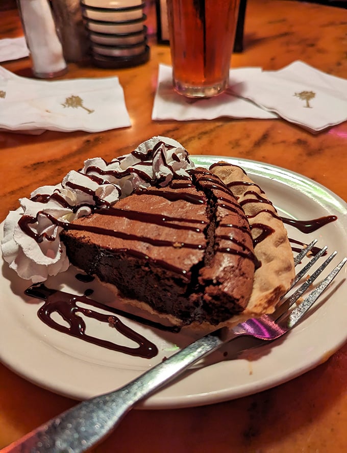 Chocolate cake that doesn't just end a meal – it creates a grand finale. Rich, decadent, and drizzled with chocolate sauce that makes resistance utterly futile.