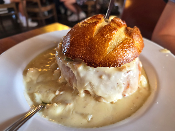 Behold the chowder burger of dreams—a crusty bread-bowl fortress cradling a creamy chowder treasure, ready to be devoured from the outside in.