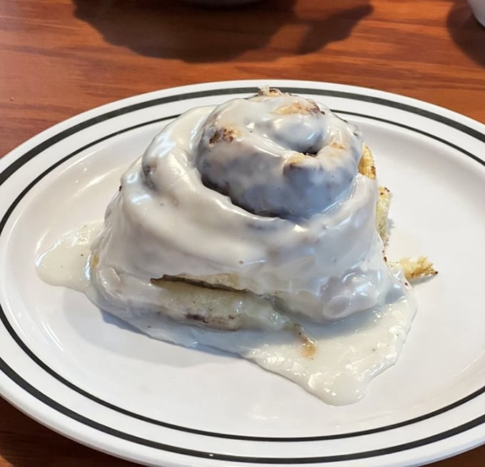The cinnamon roll isn't just big, it's life-changing – a spiral of joy topped with icing that doesn't know the meaning of restraint. 