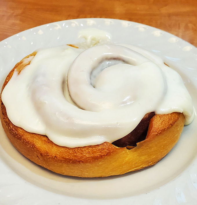 This isn't just a cinnamon roll—it's what other cinnamon rolls dream of becoming when they grow up. That frosting swirl deserves its own Instagram.