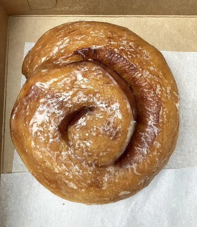 The cinnamon roll that ate Manhattan. This spiral of sugary perfection is what breakfast dreams are made of—large enough to share, good enough not to.