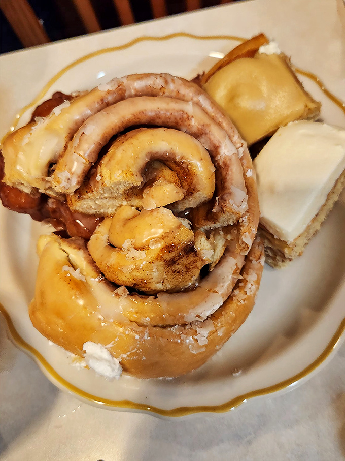 This cinnamon roll isn't just dessert—it's architecture. Layers of buttery dough spiraling toward a center that's practically caramelized heaven.