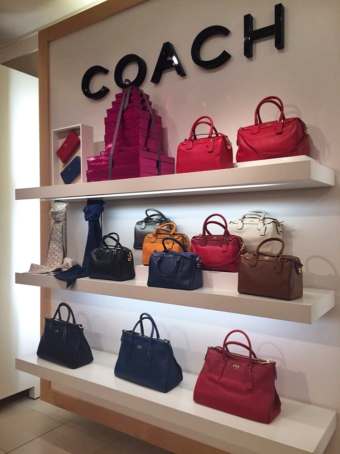 Coach's display of colorful handbags creates an art gallery of leather luxury. The perfect place to find that statement piece without the full luxury price tag.