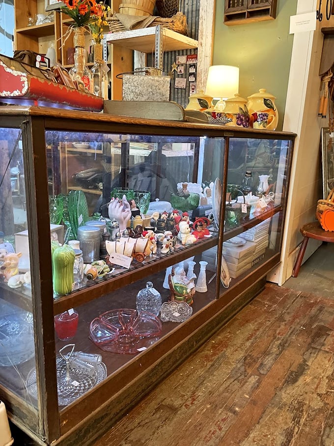 This vintage display case doesn't just hold collectibles—it's a museum where every tiny treasure tells a story. Window shopping within window shopping!