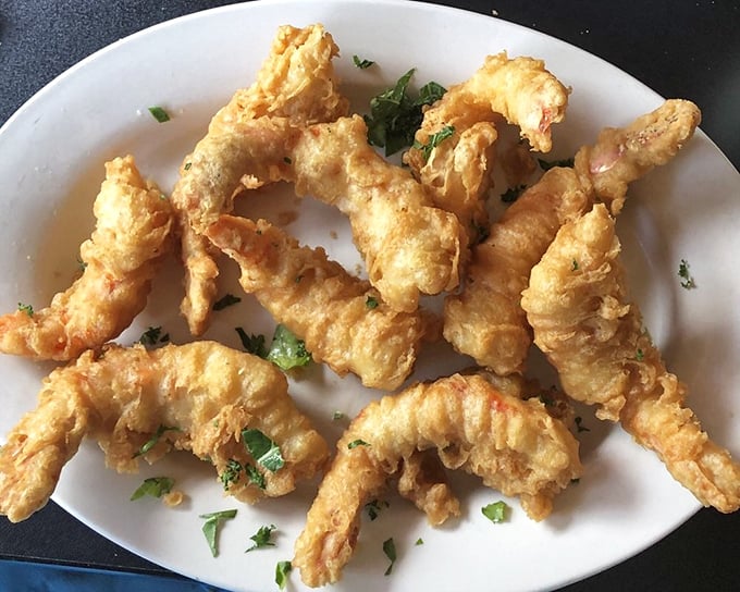 These golden-battered shrimp look like they're doing a synchronized swimming routine on their way to flavor town.