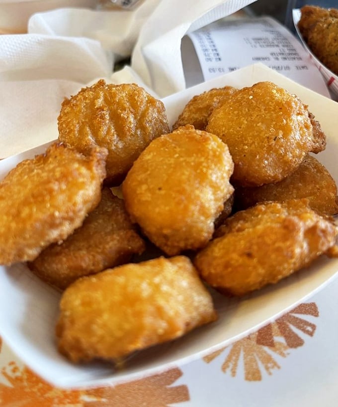 These golden nuggets of joy aren't just appetizers—they're little ambassadors of happiness that make waiting for your chicken almost as enjoyable as the main event.