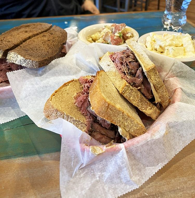 Stacked higher than your weekend reading pile, this sandwich doesn't just satisfy hunger—it conquers it. The bread is merely the delivery system for meat perfection.