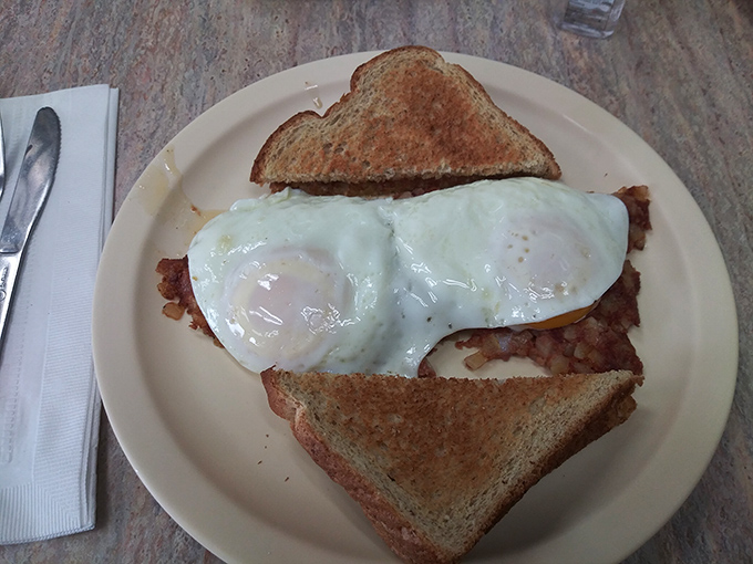 The breakfast equivalent of hitting the jackpot. Crispy corned beef hash topped with perfectly sunny eggs—comfort food that hugs you from the inside.