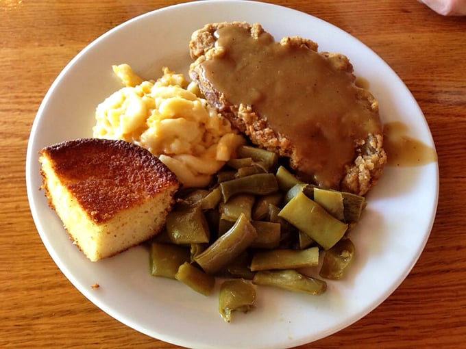Country fried steak with gravy so good you'll want to write poetry about it. Paired with cornbread and green beans—this is Georgia on a plate.
