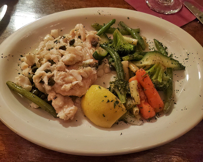 The seafood here doesn't just swim to your plate – it practically performs a synchronized routine before melting into buttery bliss alongside seasonal vegetables.