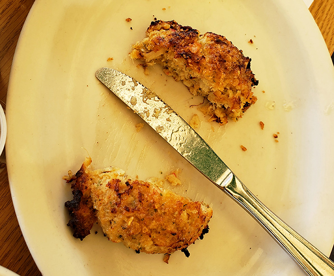 These golden-brown crab cakes aren't just food – they're edible evidence that simple preparation lets quality ingredients shine brightest.