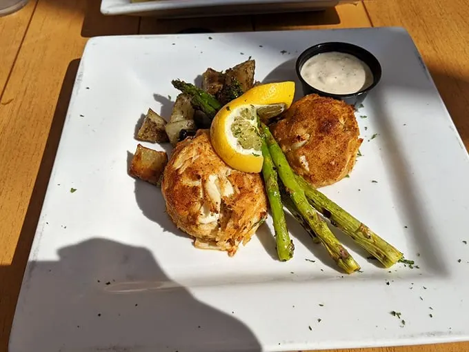 Crab cakes that actually taste like crab, not breadcrumbs—paired with roasted potatoes and asparagus for a plate that honors Pennsylvania's proximity to Maryland's seafood bounty.