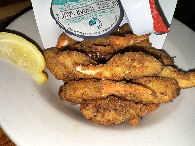 Golden-fried crab claws—the finger food that makes you forget your manners. That squeeze of lemon isn't optional; it's the final brushstroke on a masterpiece.