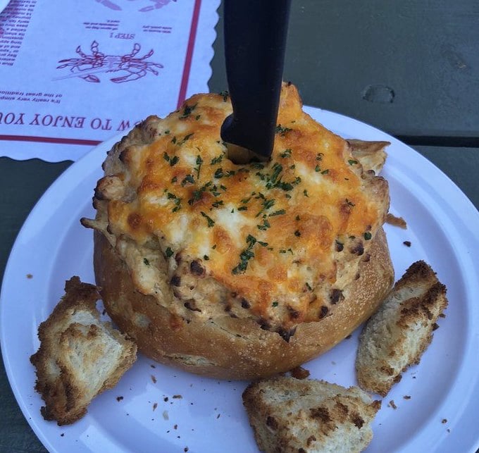 Crab dip served in a bread bowl: where comfort food meets maritime decadence, creating the kind of dish you'll reminisce about during future salad lunches.