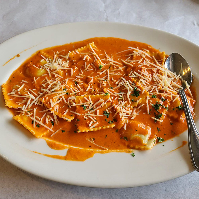 Ravioli swimming in a sunset-colored sauce that belongs in the Louvre. Art you can eat with a fork!