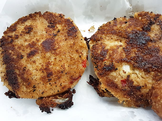 These crab cakes pack more seafood than a fishing boat – no filler, just pure deliciousness.