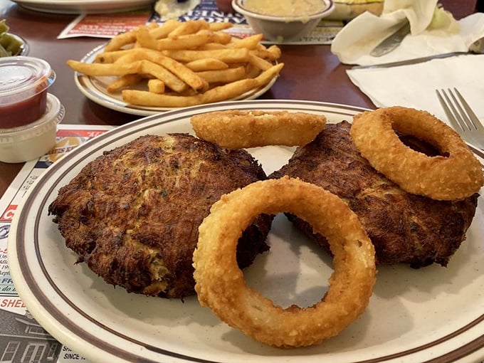 Golden-brown crab cakes and crispy onion rings—proof that sometimes the simplest pleasures are the most satisfying.