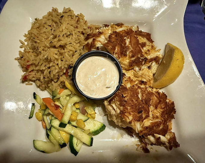 Maryland-style crab cakes that are all crab, no filler—golden brown perfection that tastes like the Chesapeake Bay took a Florida vacation.