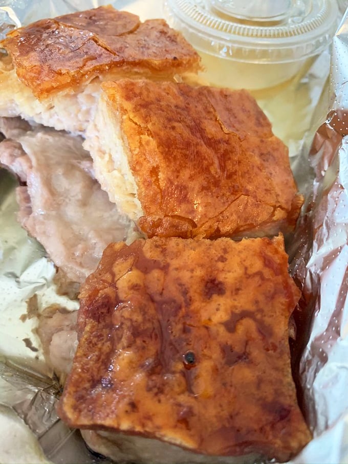 Crispy pork belly that shatters then melts, creating a textural experience that might just ruin all other pork for you forever.