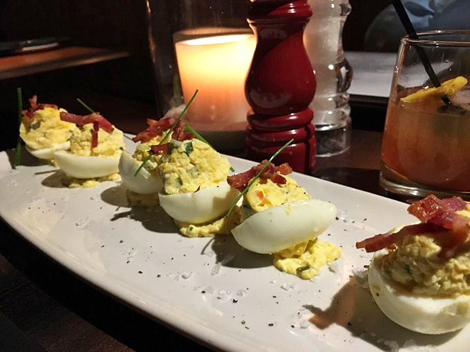 Deviled eggs elevated to art form – these aren't your aunt's potluck contribution, though she'd certainly approve of the bacon garnish.