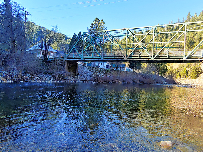 The Durgan Bridge spans the crystal-clear waters that have shaped both Downieville's landscape and its soul – a perfect frame for that "I found paradise" social media moment.
