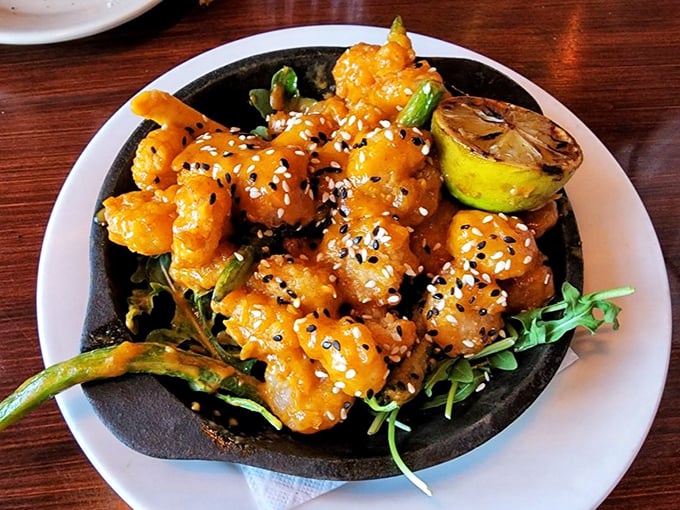 Crispy, saucy, and utterly irresistible—these sesame-flecked shrimp could make even the most dedicated landlubber swoon.