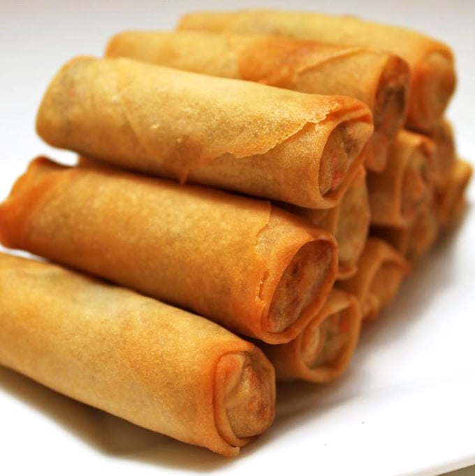 These perfectly rolled, golden-brown spring rolls aren't just appetizers—they're the opening act to a symphony of flavors waiting in the wings. 