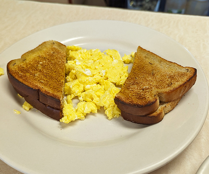 Golden-edged toast and sunshine-yellow eggs—breakfast fundamentals executed with the precision of a culinary symphony.