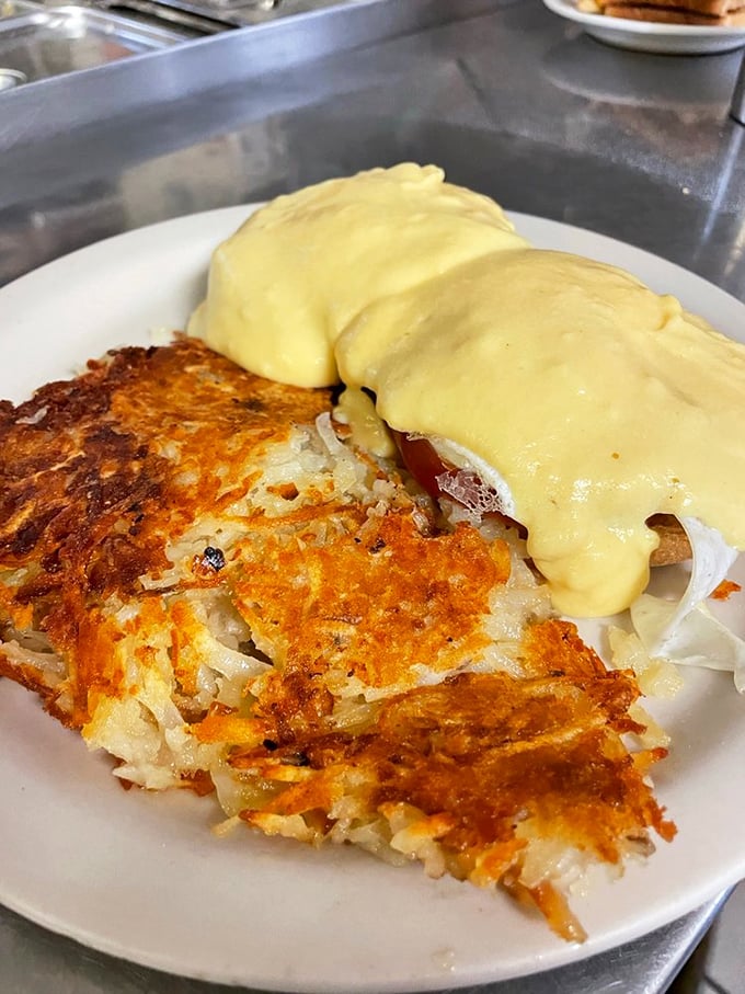 Golden hash browns meet hollandaise in this Eggs Benedict that would make any brunch enthusiast weak at the knees.