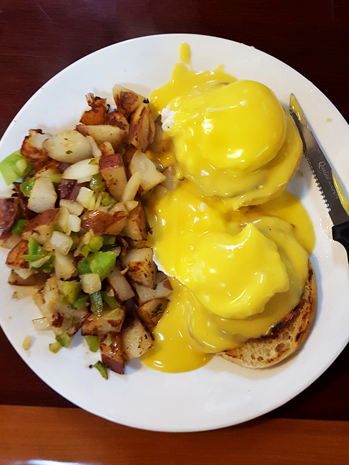 Hollandaise cascading like a golden waterfall over English muffins and poached eggs—Benedict done right is morning poetry on a plate.