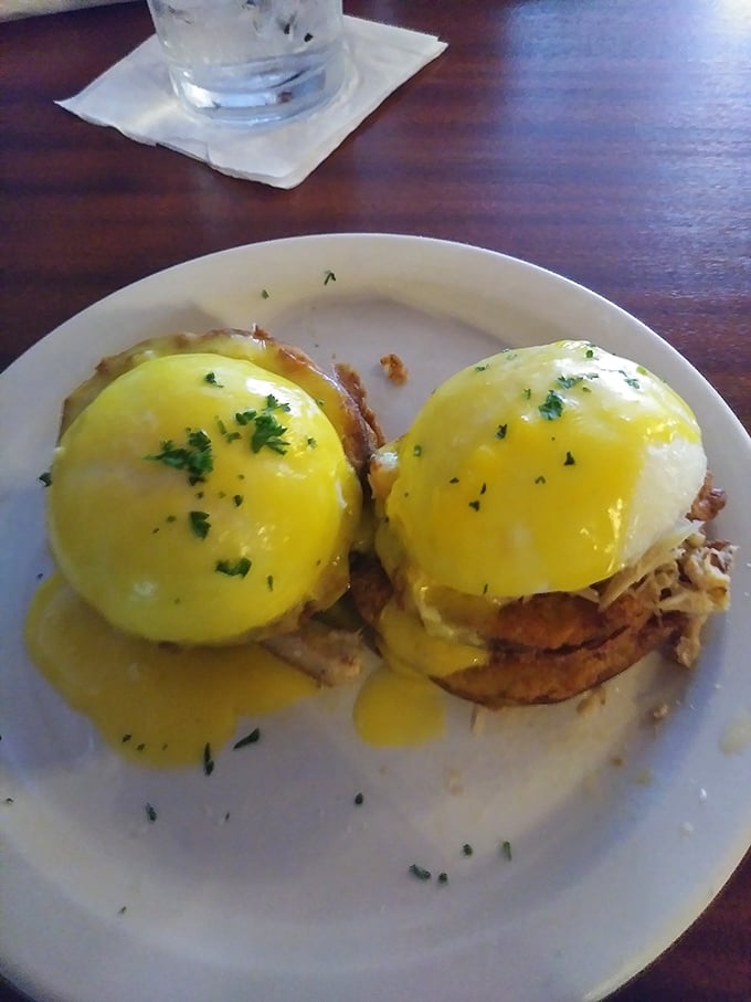 Sunshine on a plate. These eggs benedict boast perfectly poached eggs with hollandaise cascading down like a yellow waterfall of flavor.