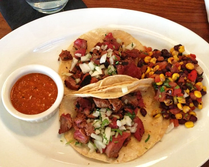 Tacos reimagined through a steakhouse lens: tender beef, fresh salsa, and a corn relish that makes you question everything you thought you knew. 