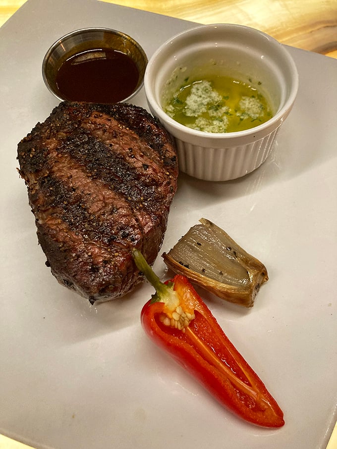 This filet mignon isn't just cooked—it's been sweet-talked to perfection with a side of vegetables that didn't die in vain.