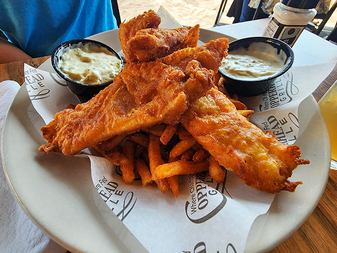 Fish and chips that would make a British pub regular nod in approval. The golden batter crackles just by looking at it—no passport required.