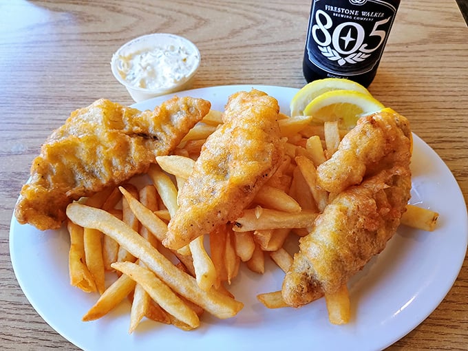 Fish and chips done right—golden-battered cod with a crunch that echoes across the Pacific, alongside fries that demand to be noticed.