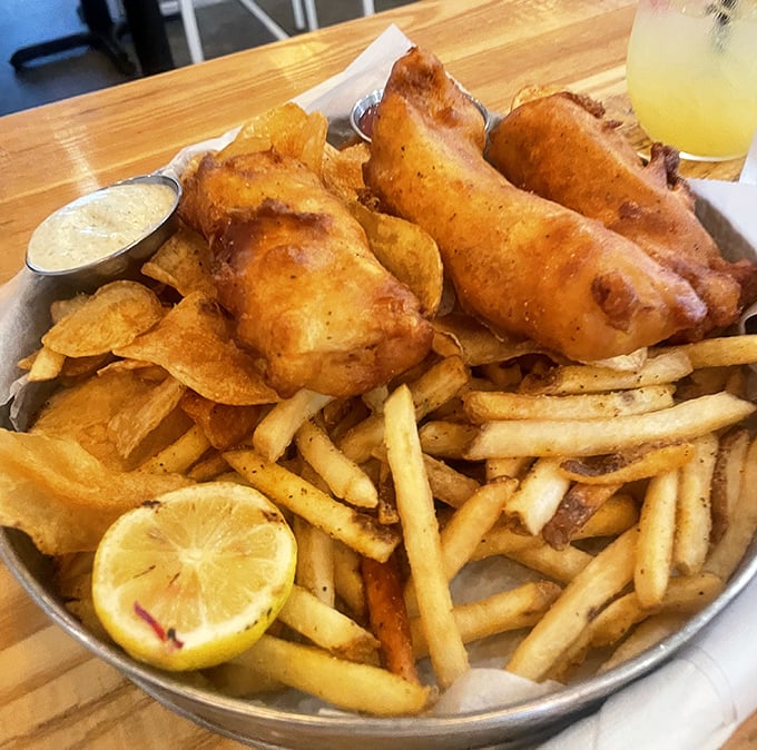 Golden-battered fish and perfectly crisp fries that would make a British pub jealous. The lemon wedge isn't just garnish—it's essential for that perfect citrus zing.