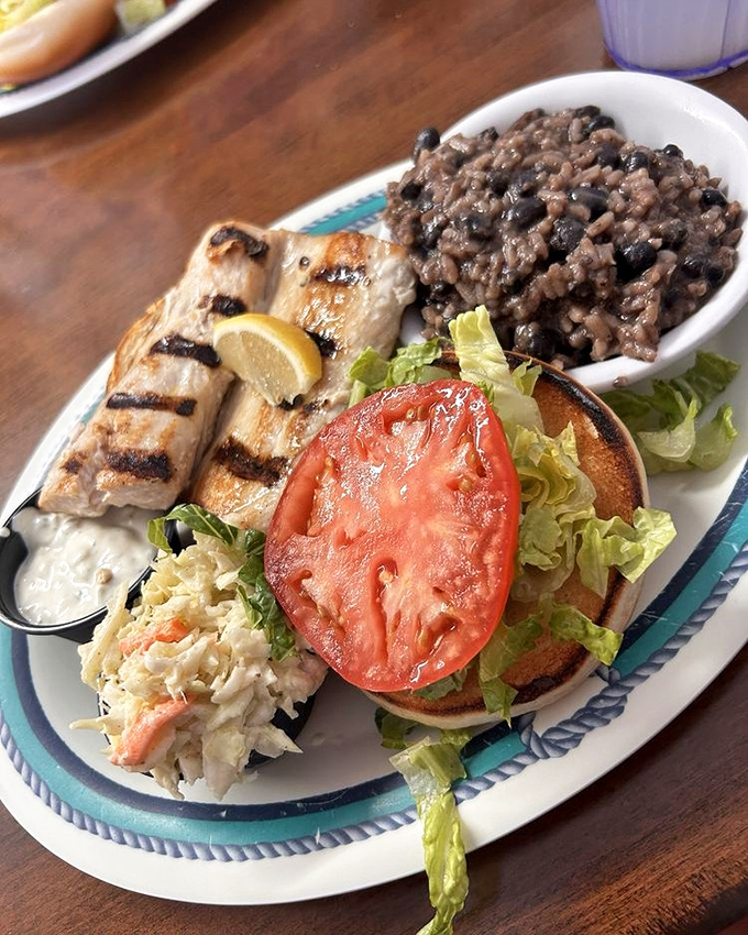A sandwich that tells the story of the Keys in one bite—fresh fish, crisp vegetables, and the promise of an afternoon nap.