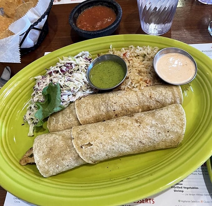 These tacos aren't just wrapped, they're gift-packaged with love. The accompanying sauces are like choosing your own adventure – each path delicious.