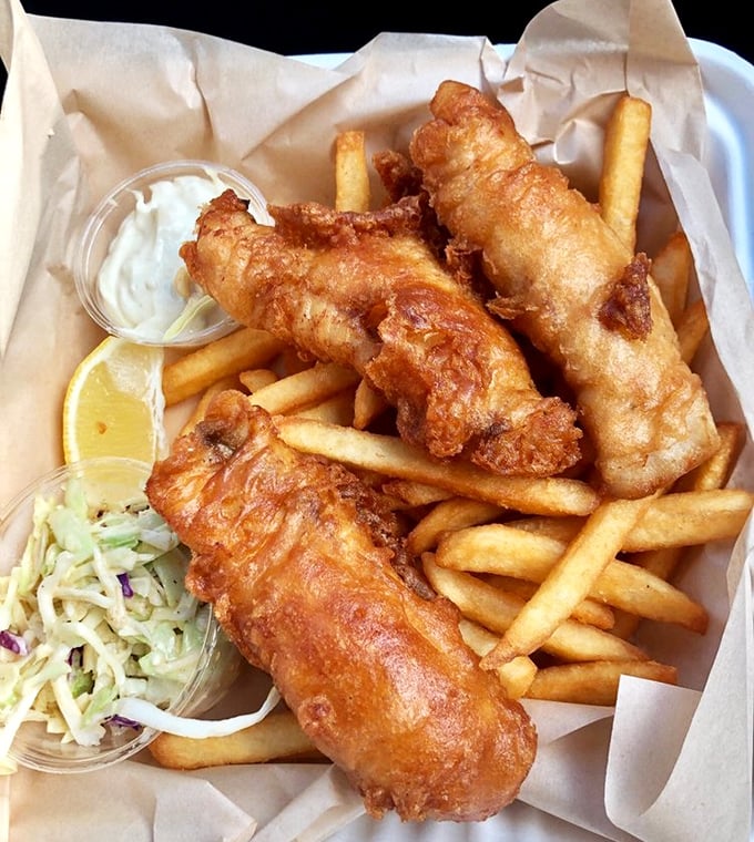 Beer-battered fish so crisp it practically shatters, paired with fries that deserve their own fan club. The coleslaw prevents scurvy—how thoughtful!