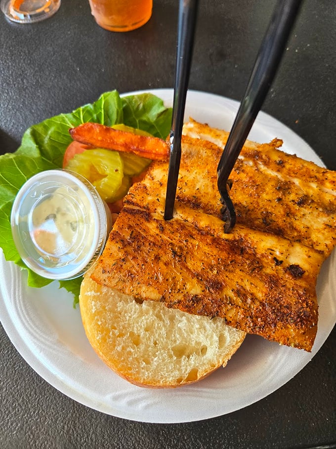 The blackened fish sandwich – where the fish extends beyond the bun's borders because generosity isn't just a virtue, it's a serving style.