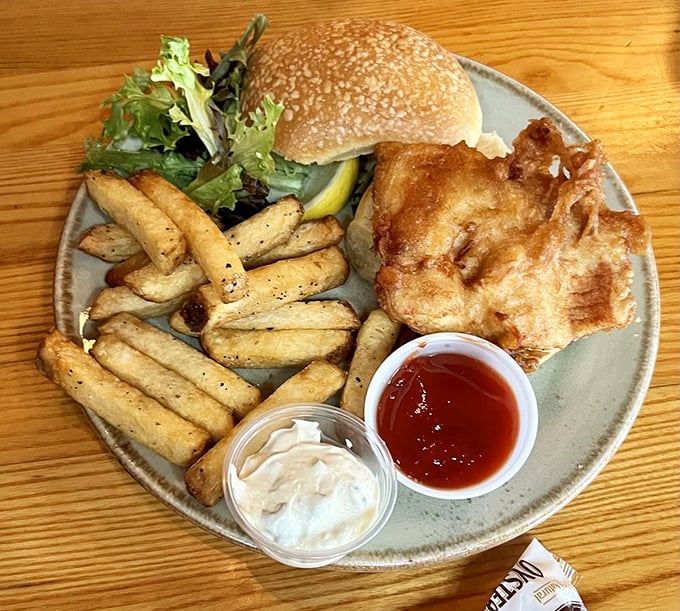 This fish sandwich doesn't need fancy aioli or artisanal nonsense—just perfectly fried freshness on a bun that makes fast food fish sandwiches weep with inadequacy.
