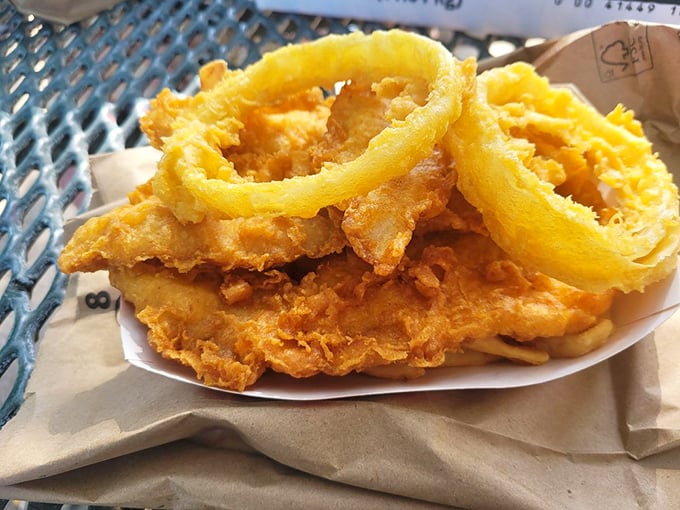 The onion rings deserve their own fan club—ethereally light, perfectly golden, and large enough to double as maritime life preservers in an emergency.