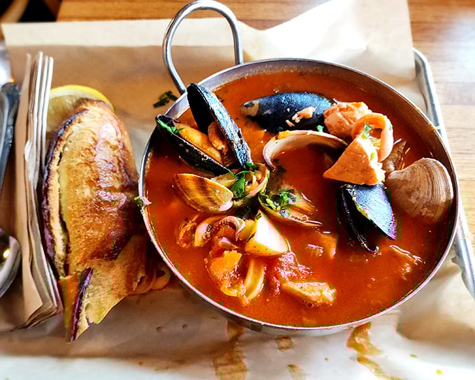 This fisherman's stew isn't just a meal—it's a maritime celebration in a bowl. The toast is just there to soak up your tears of joy.