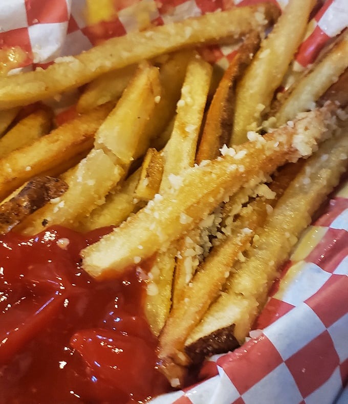 Hand-cut fries dusted with parmesan and spices – the kind that make you wonder why you ever settled for the frozen variety.