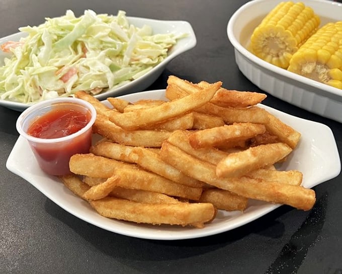 Golden fries that achieve that mythical balance—crispy exterior, fluffy interior—the perfect supporting actor in the seafood blockbuster playing out on your table.
