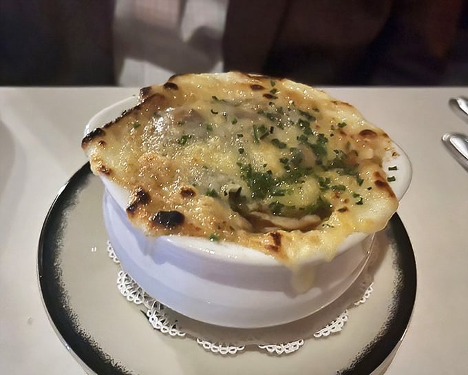 French onion soup that doesn't just warm your stomach—it hugs your soul. That cheese pull could win Olympic medals for stretching.